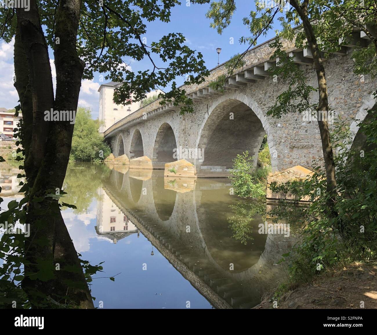 Perfect symmetry created between the rock bridge and the lake Stock ...
