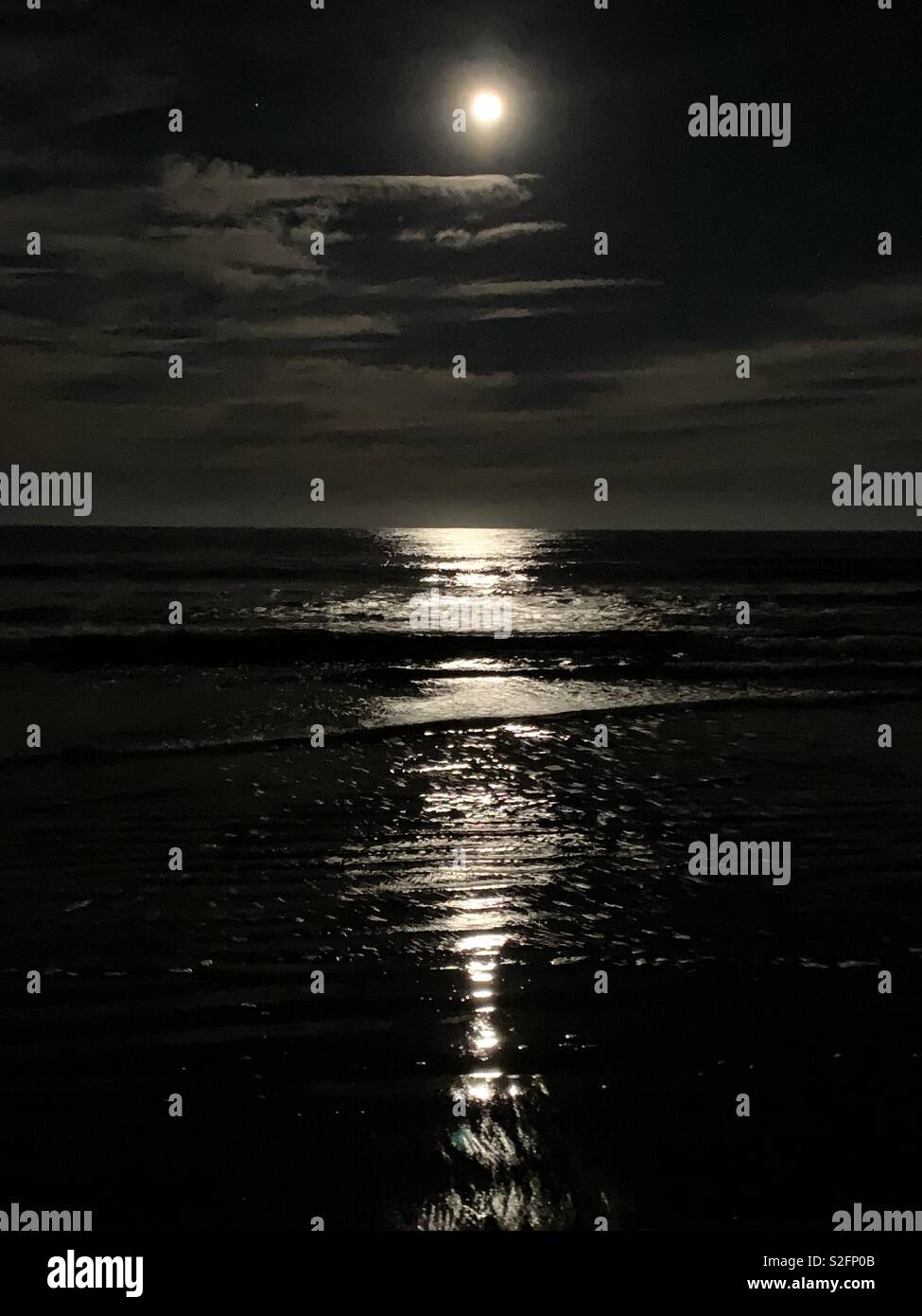 Moon over water Stock Photo - Alamy
