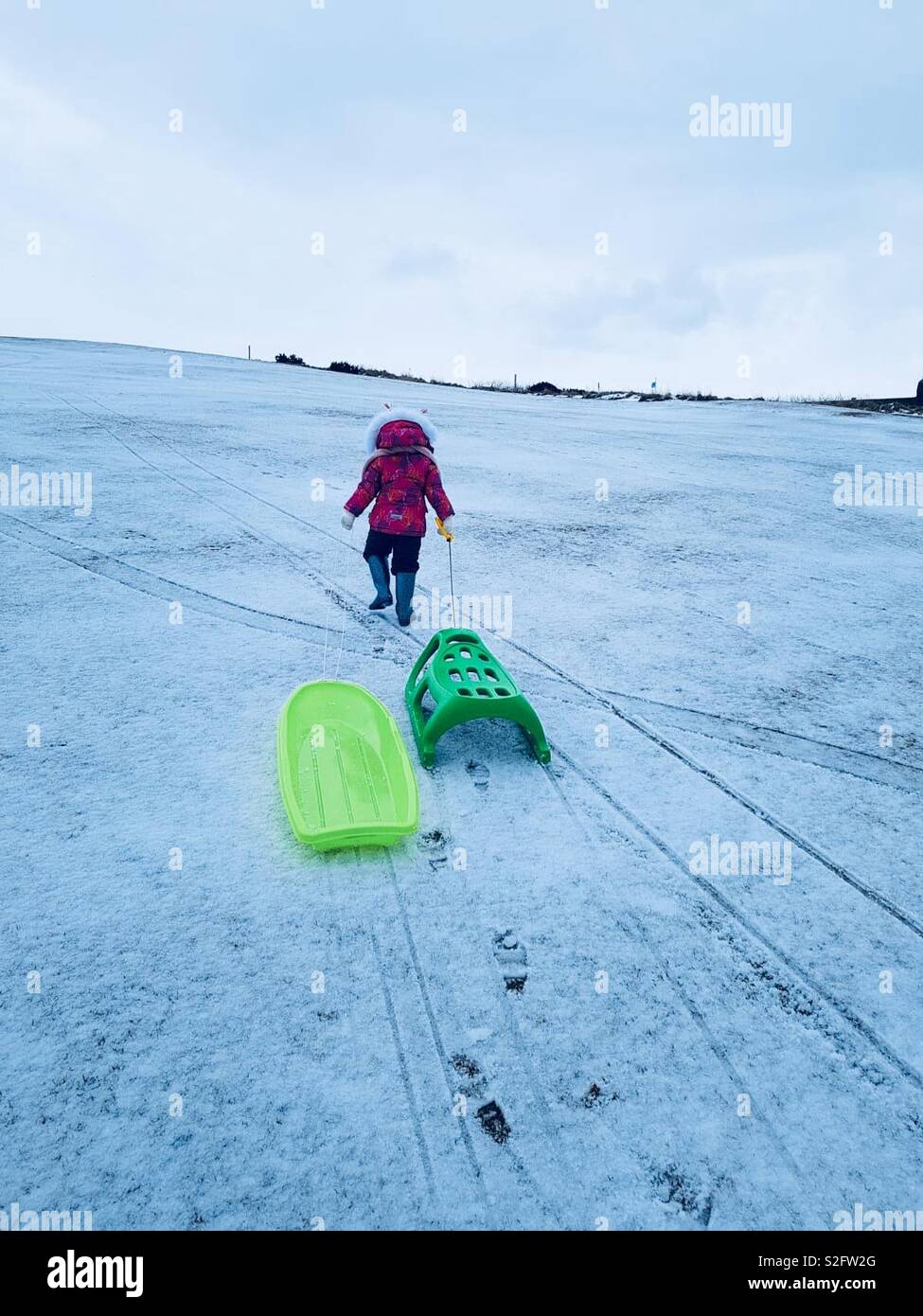 Walking in snow with sledges hi-res stock photography and images - Alamy