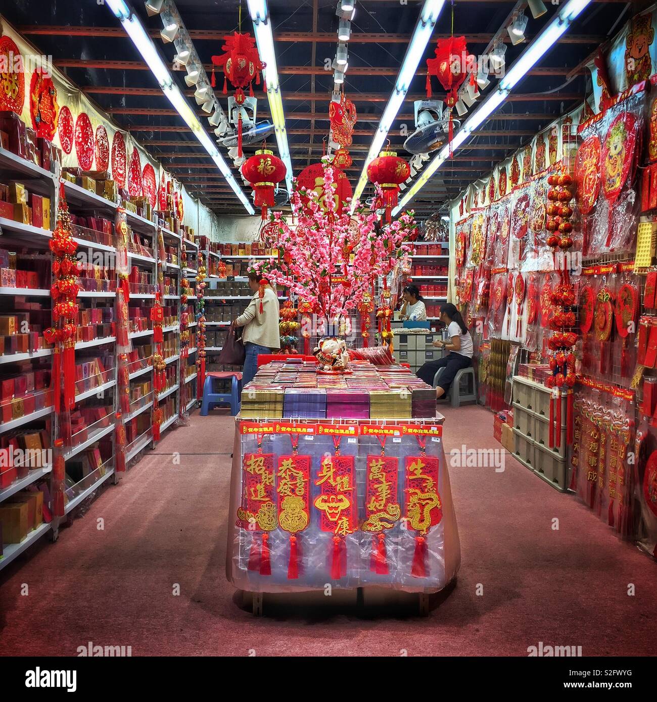 A shop sells paper ‘lai see’ red envelopes and other decorations for ...