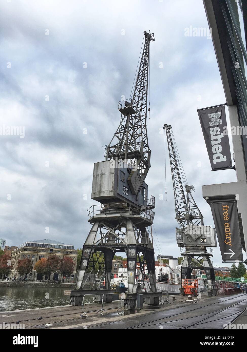 Preserved dockside cranes outside the M Shed museum in Bristol, UK ...