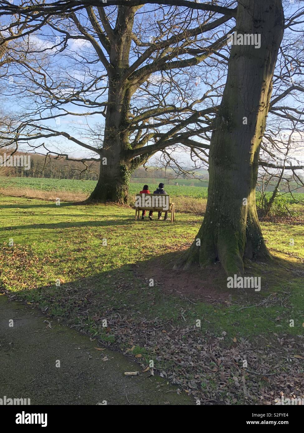 A couple taking advantage of the beautiful sunny weather in a Devon ...