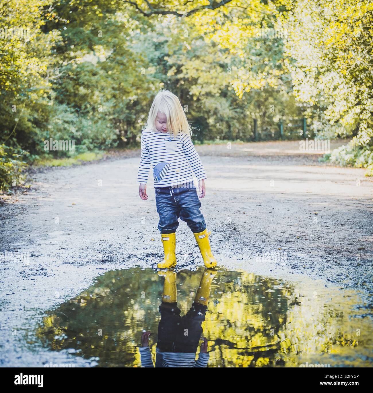 Child reflection puddle hi-res stock photography and images - Alamy