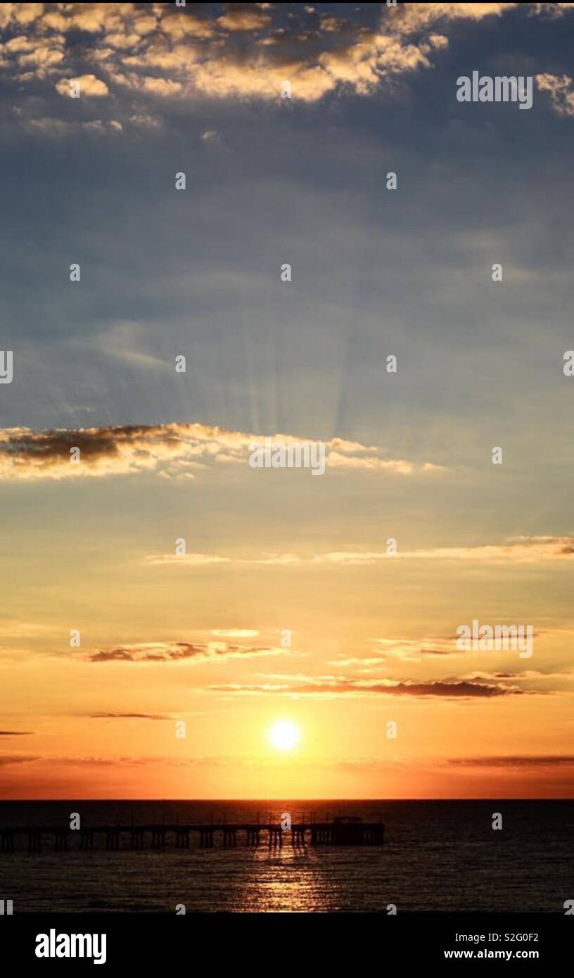 Alabama sunrise over pier Stock Photo - Alamy