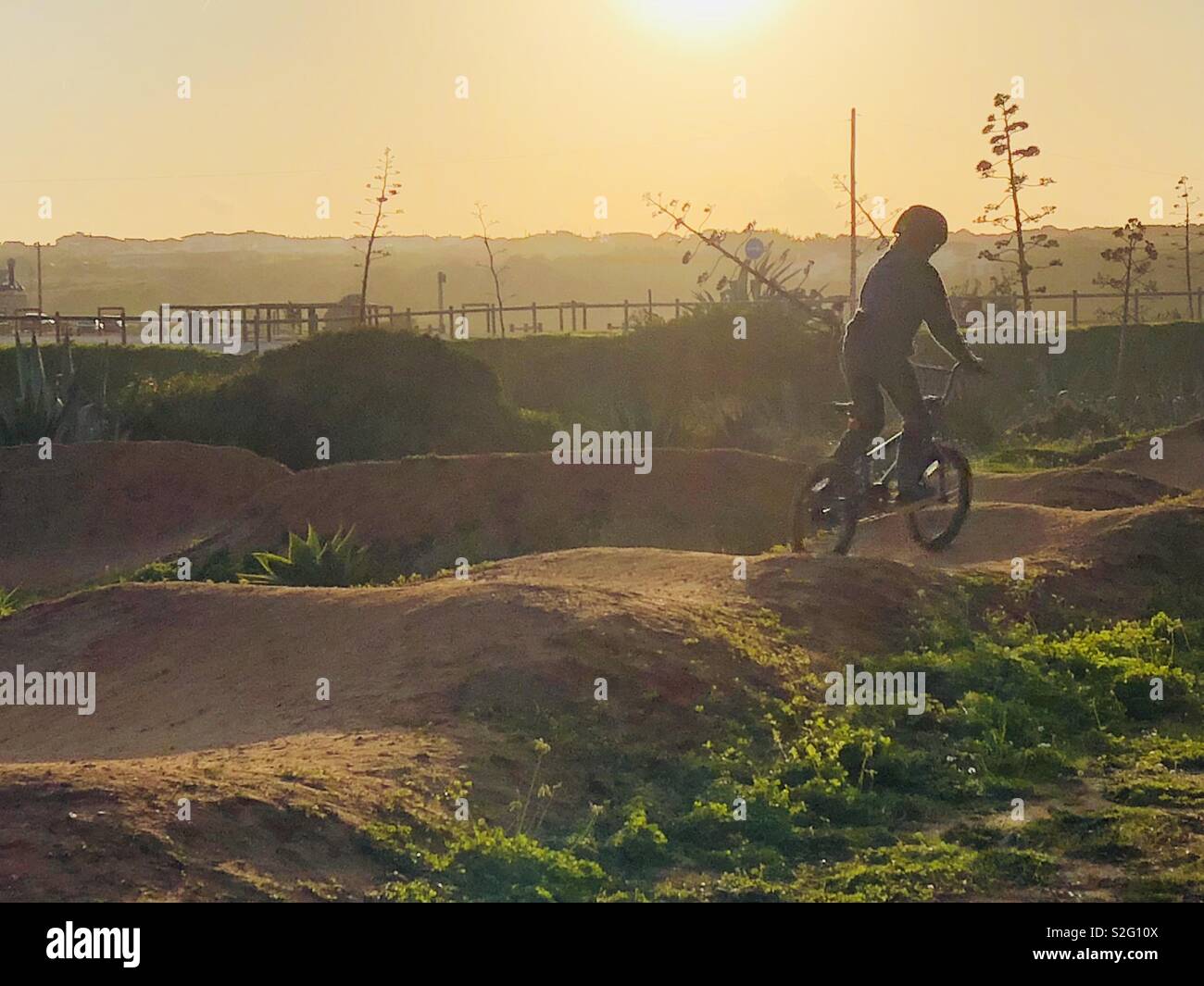 Bmx biking at sunset Stock Photo - Alamy