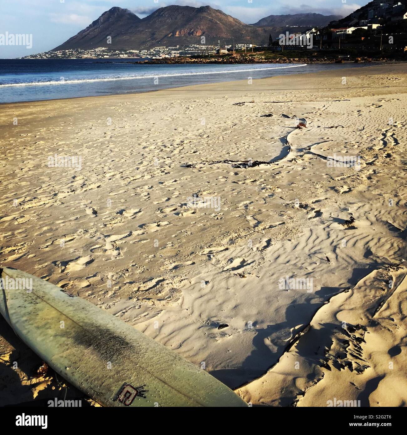 Board on the beach Stock Photo - Alamy
