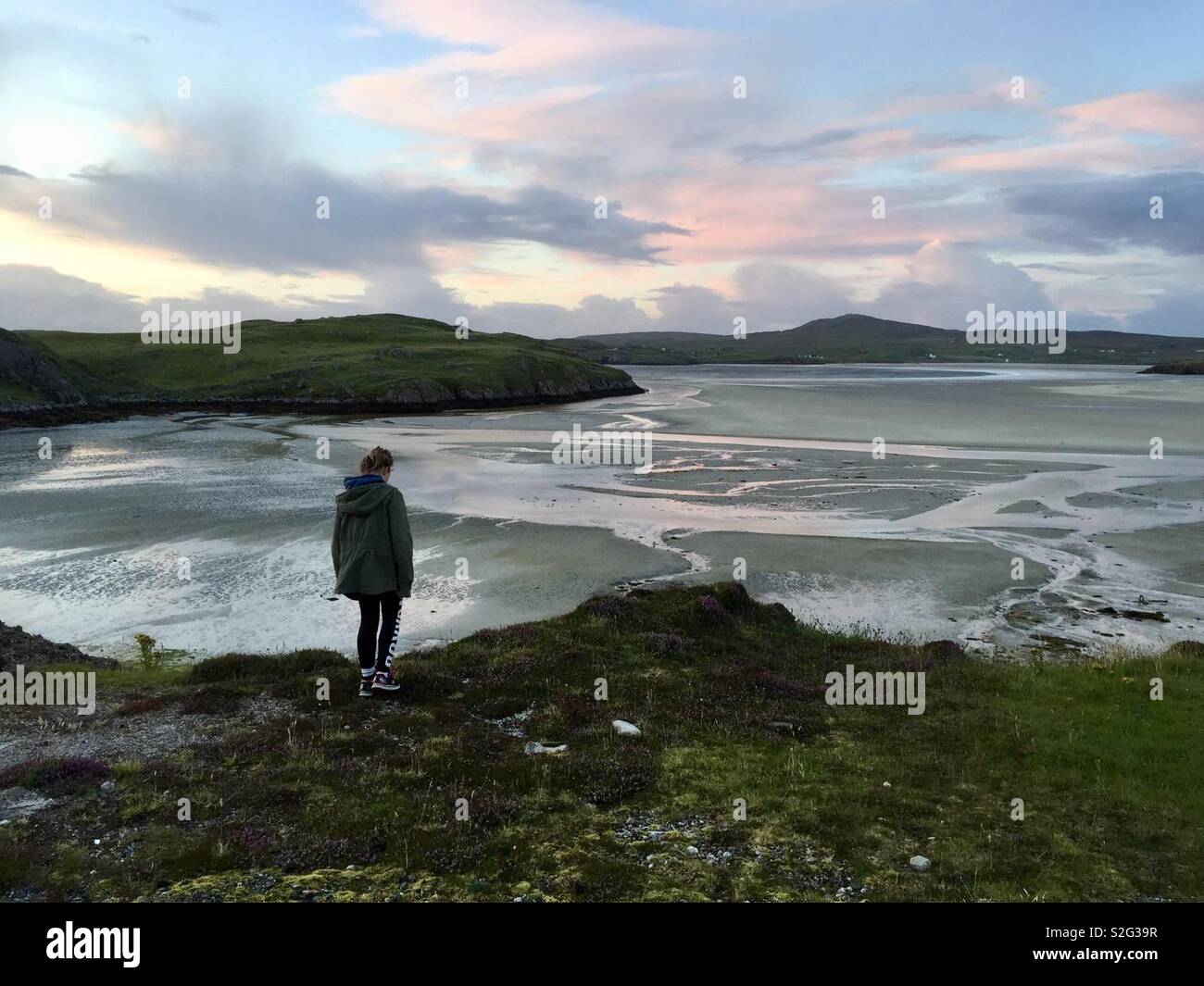 Lone figure looking out on Uig beach, Isle of Lewis, Outer Hebrides ...