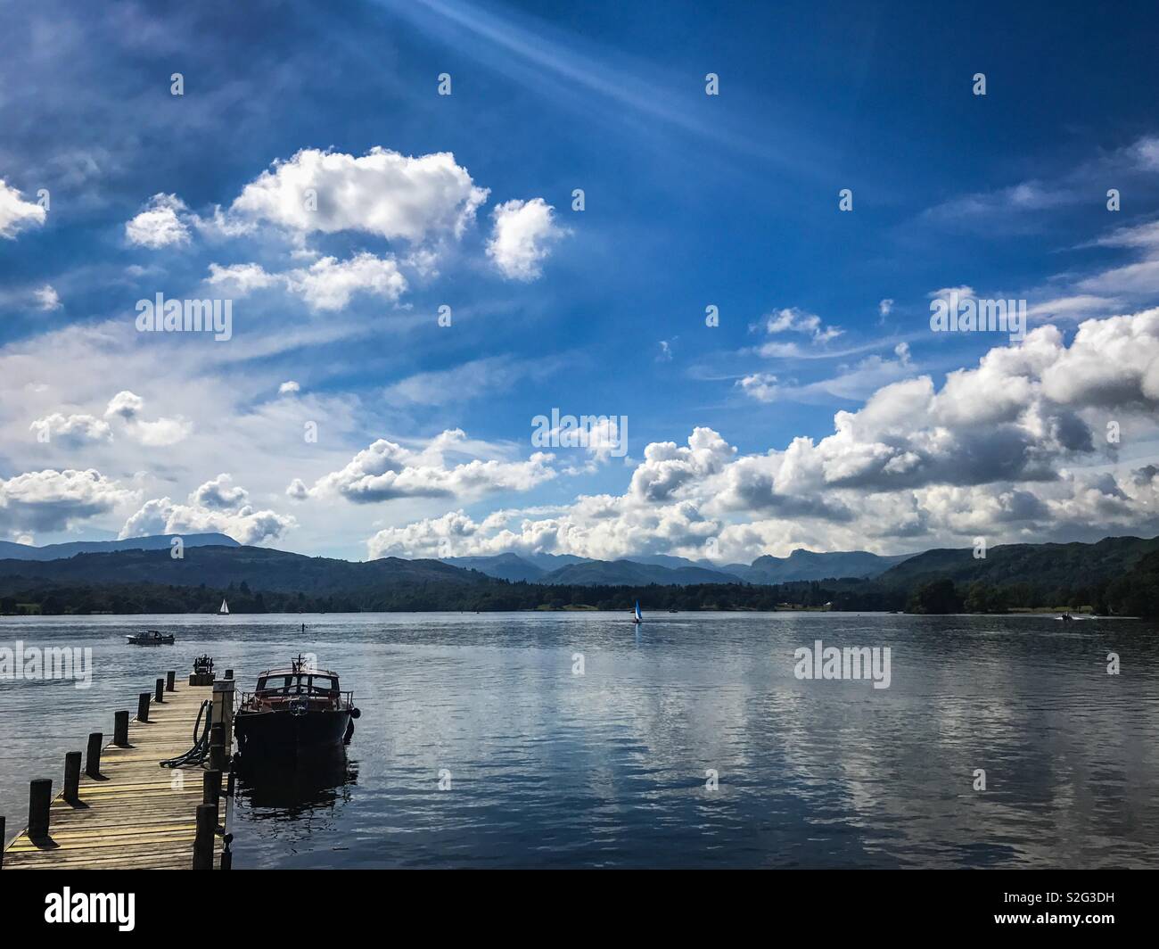 Boat at a lakeside dock Stock Photo - Alamy