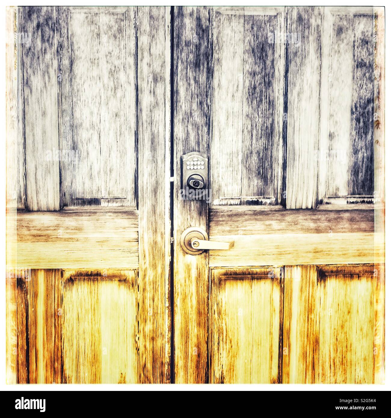 Old wood doors with Modern lock Stock Photo - Alamy