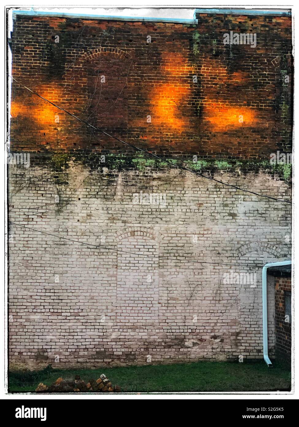 Old brick wall with the sun reflection Stock Photo - Alamy