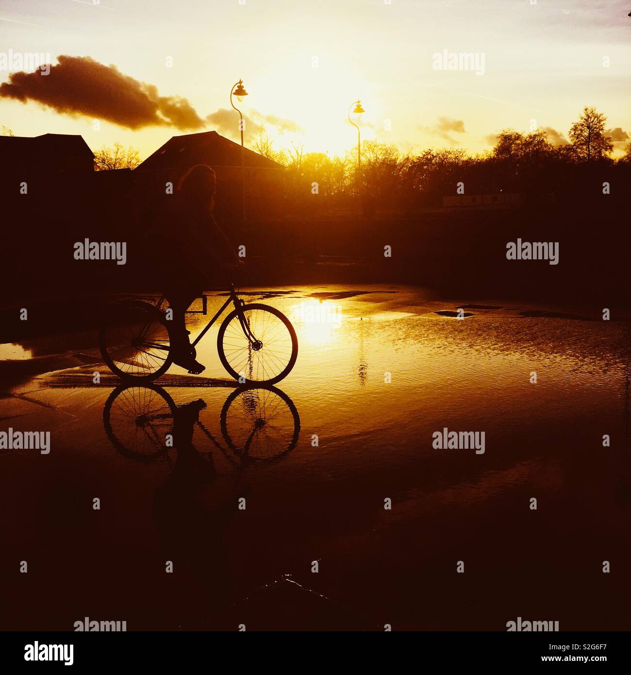 Cycling through puddle hi-res stock photography and images - Alamy