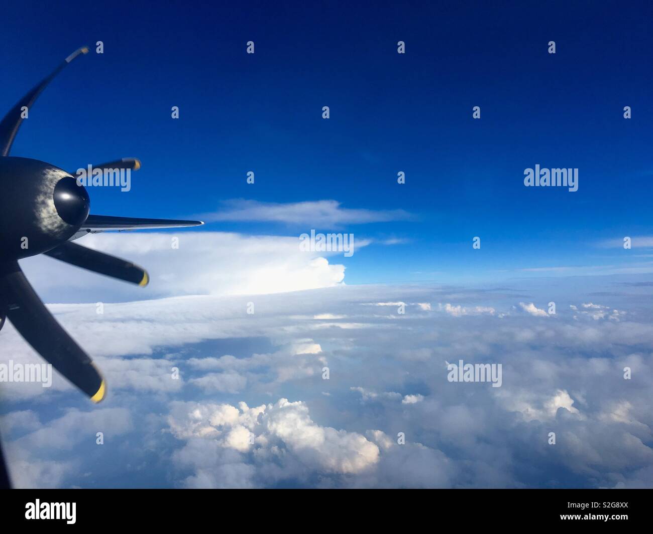 Propeller of aeroplane flying above the clouds Stock Photo - Alamy