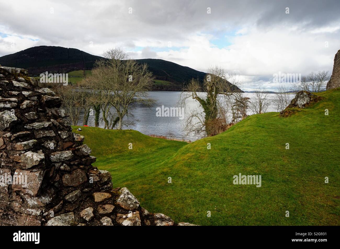 Scotland lake in the countryside with rock wall Stock Photo - Alamy