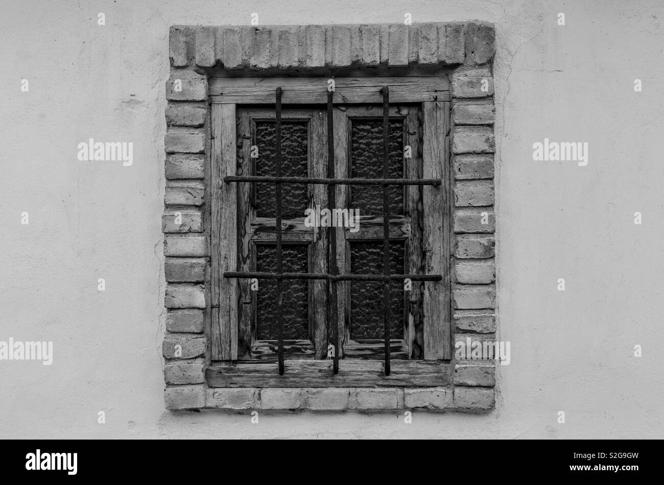 Spanish window in wood and glass with cages in black and white Stock ...