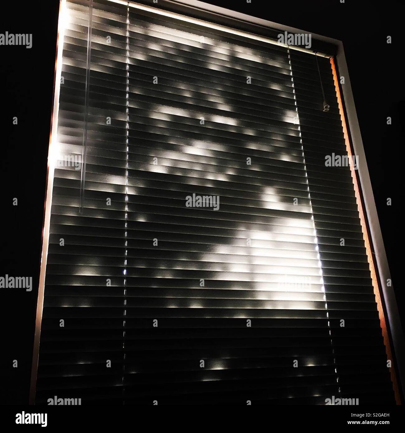 Window with Venetian mini blinds and backlit shadows Stock Photo - Alamy