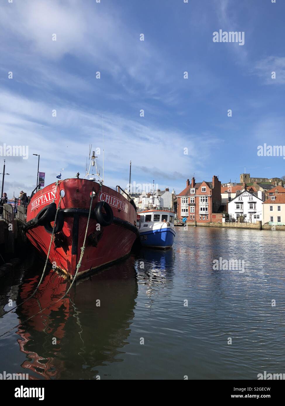 Whitby town with fishing boat Stock Photo - Alamy