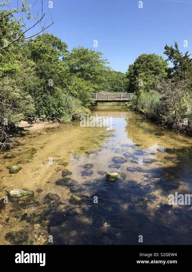 Bridge over a stream Stock Photo - Alamy