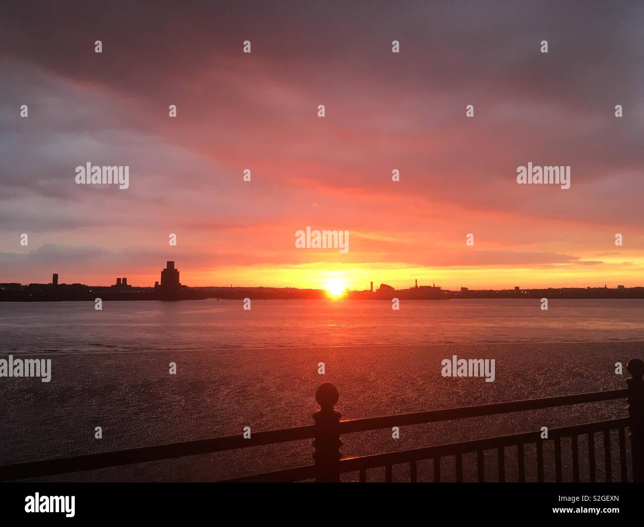 Sunset over the river Mersey in Liverpool, United Kingdom Stock Photo ...