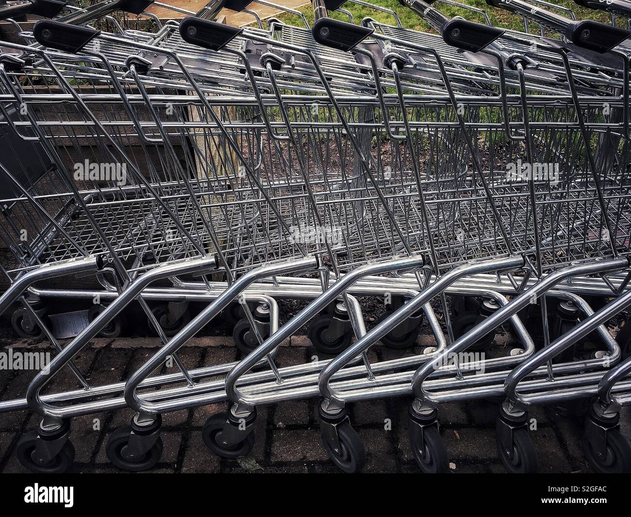 Stacked shopping trollies make patterns of interlocking geometric ...