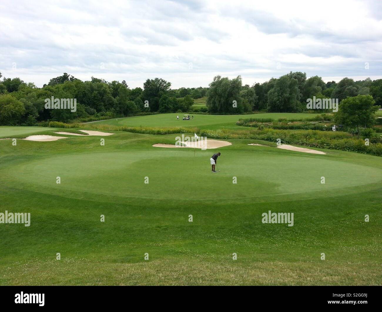 Golf putt on the 9th green Stock Photo - Alamy