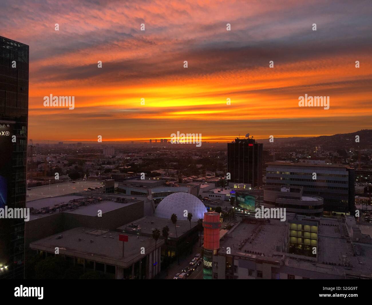 Sunset sky over city Stock Photo - Alamy