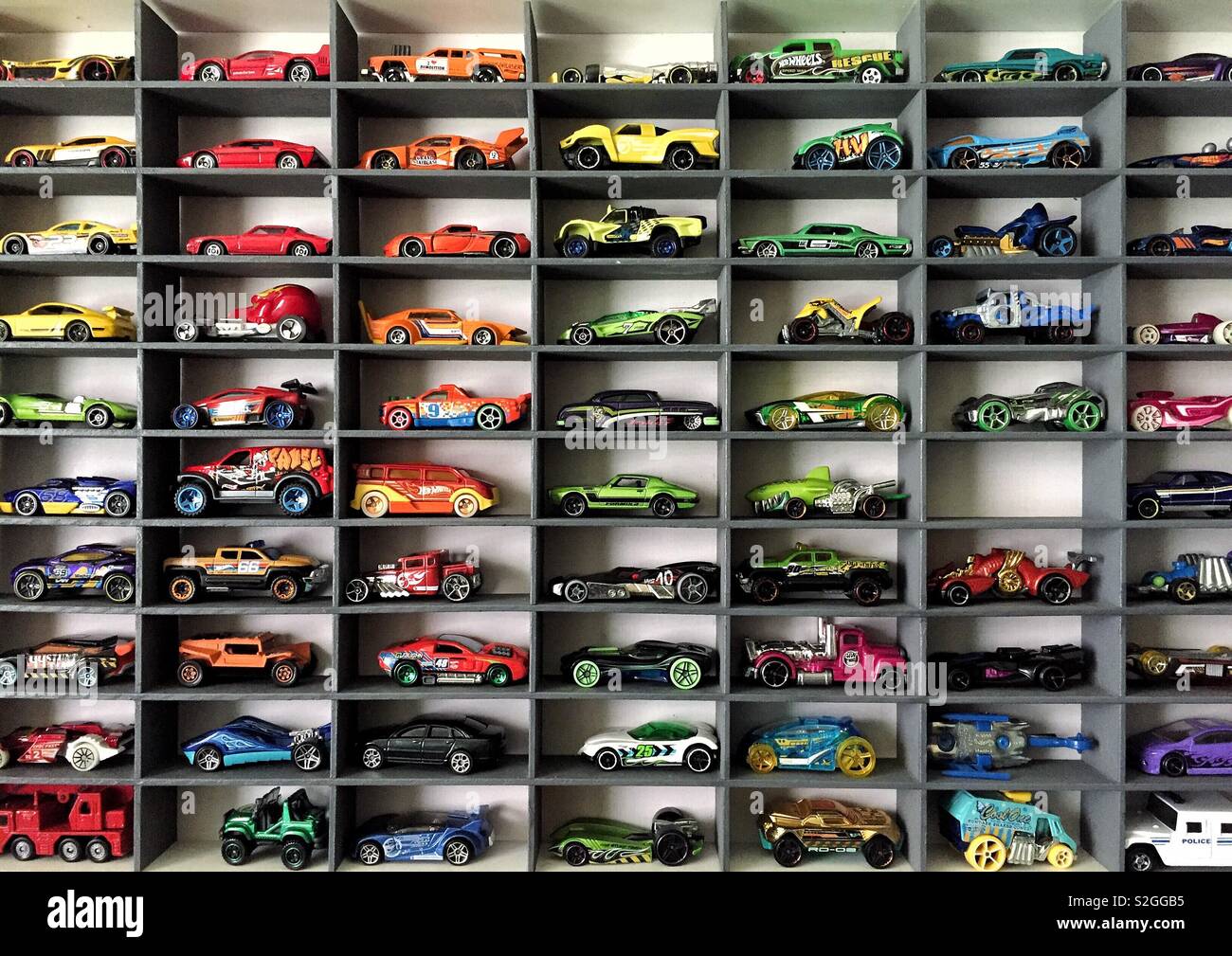 Many toy cars organized by color Stock Photo - Alamy
