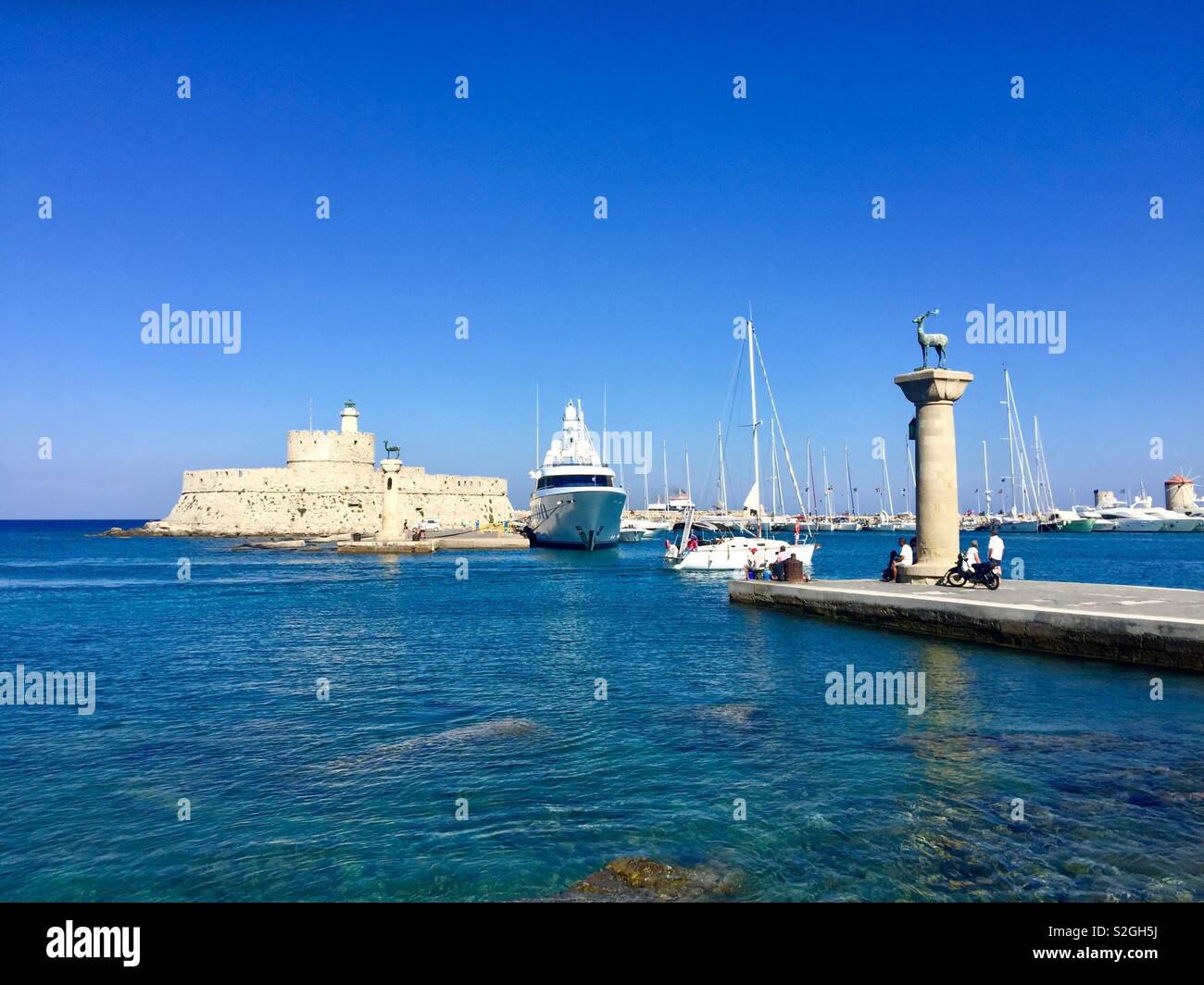 Historic Rhodes Town harbour with boats Stock Photo - Alamy