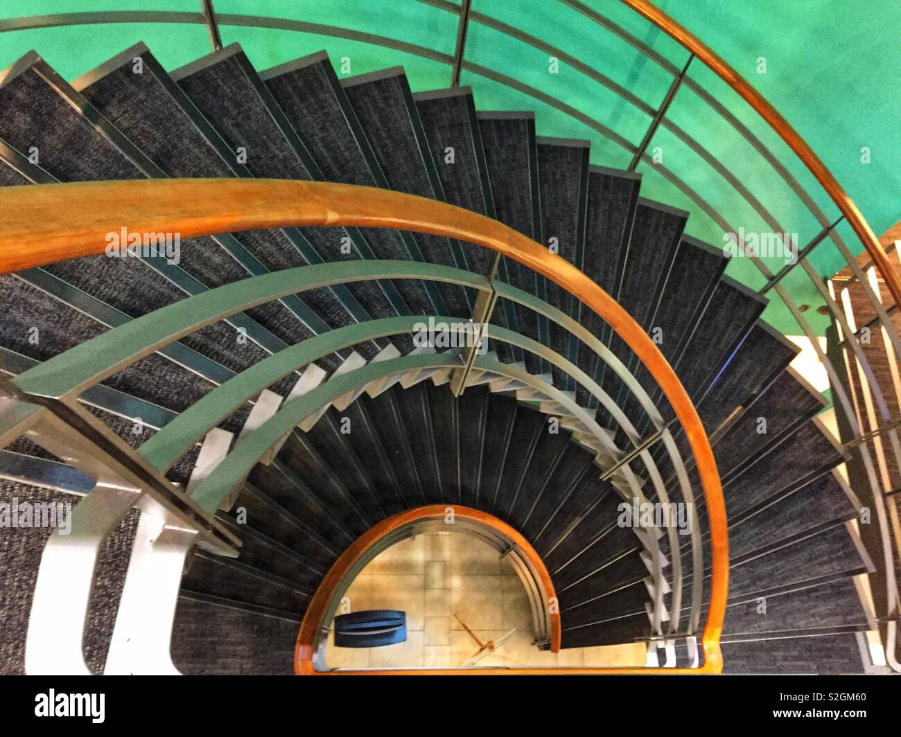 A spiral staircase in an office Stock Photo - Alamy