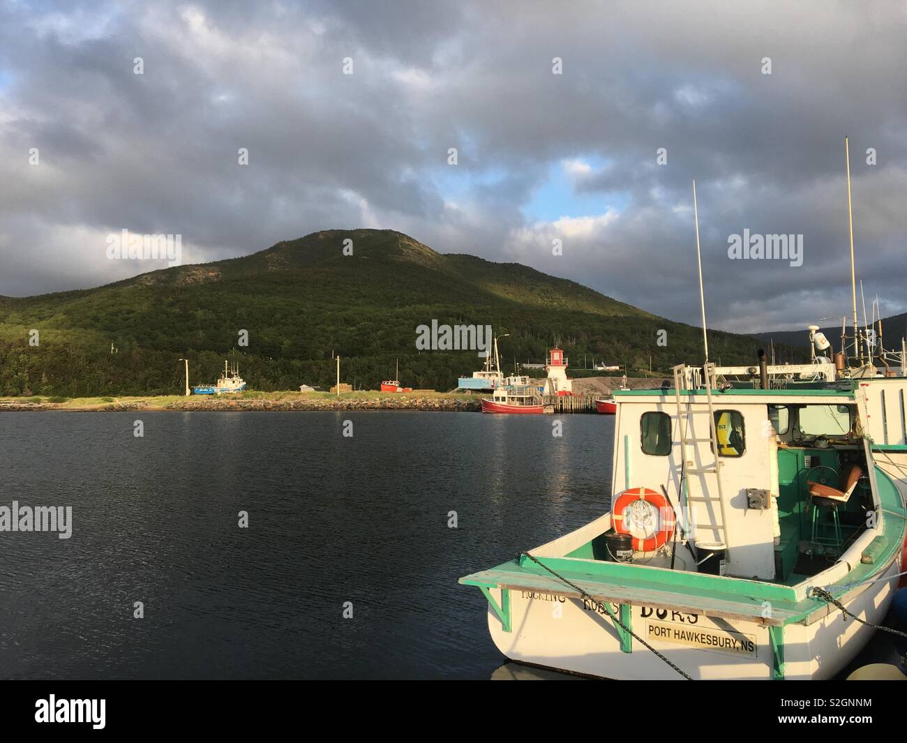 Fishing boats in Pleasant Bay Cape Breton Island over summer Stock ...