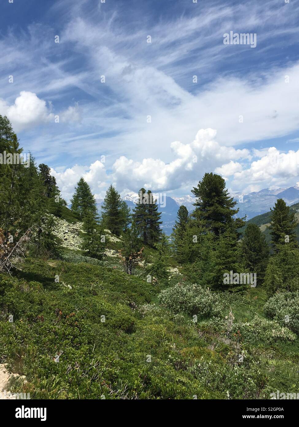 Alpine view with blue sky and clouds Stock Photo - Alamy
