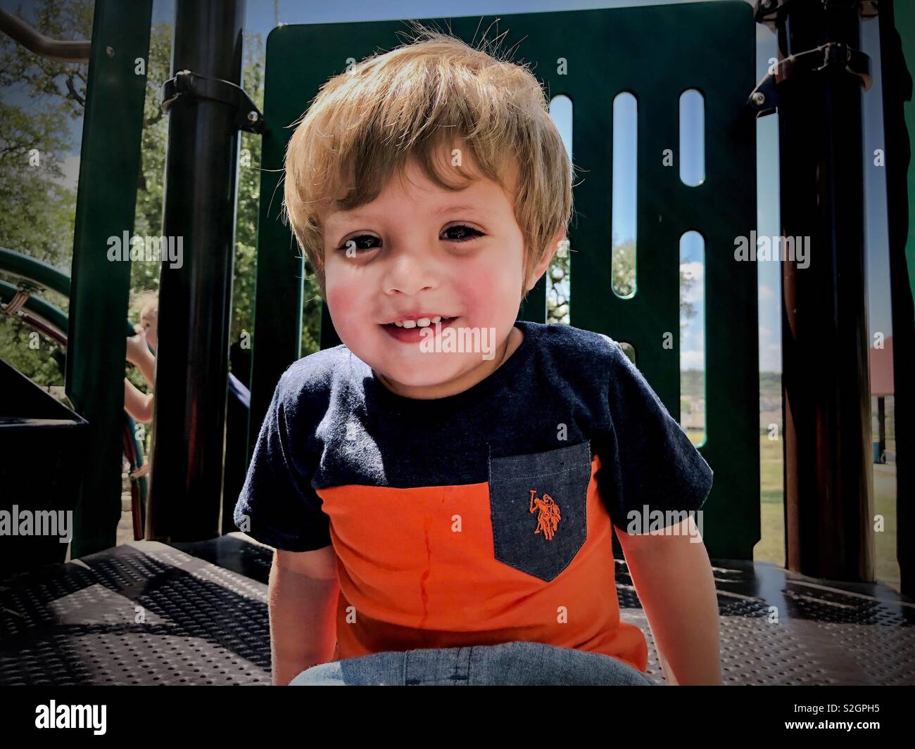 Smiling Little boy at the playground Stock Photo - Alamy
