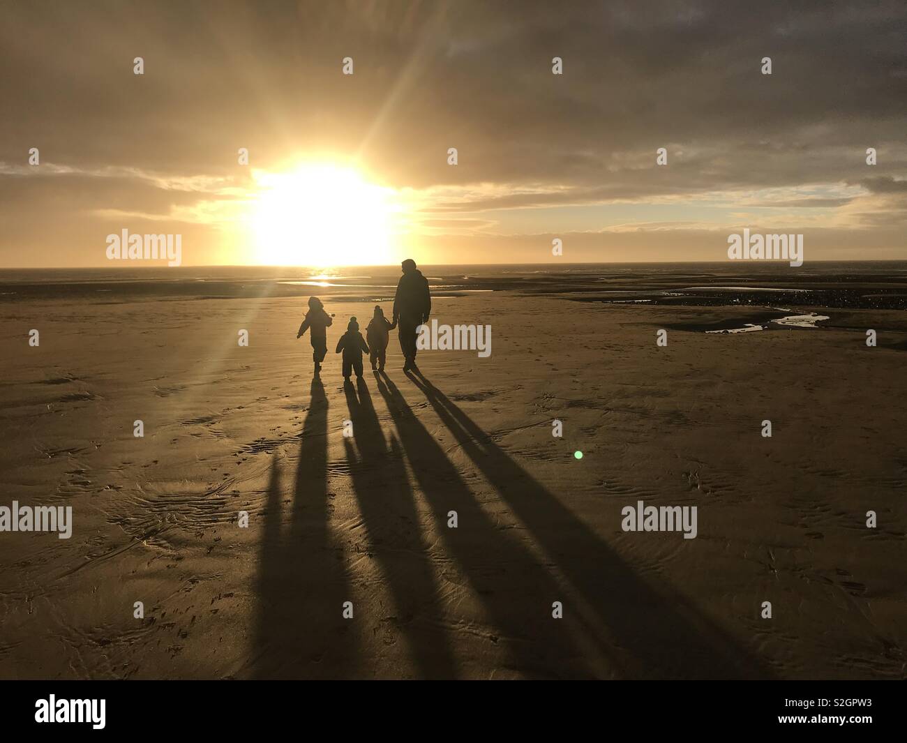 Sunset beach walk ! Stock Photo - Alamy