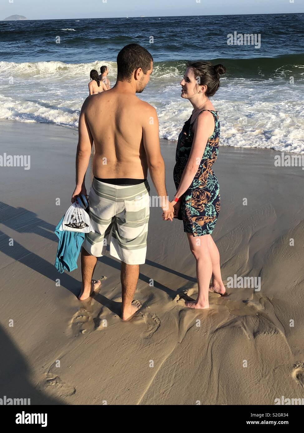 Family time at the beach in the sun, water and sand Stock Photo - Alamy