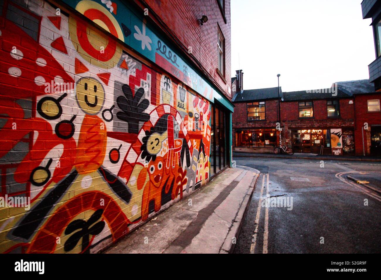 Street art in a back alley in Manchester City Stock Photo - Alamy