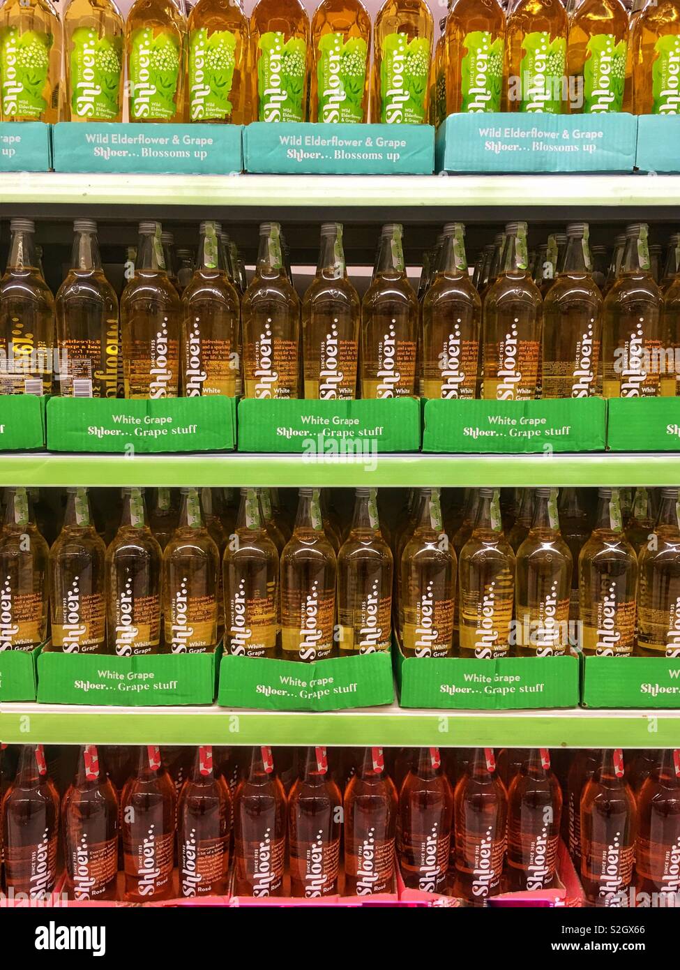 Asda supermarket shelves filled with bottles of different varieties of ...