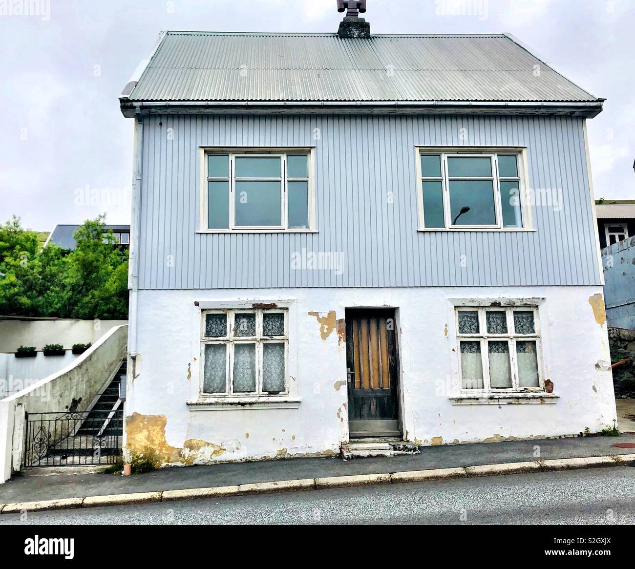 A pale blue house with four windows in the Faroe Islands Stock Photo ...