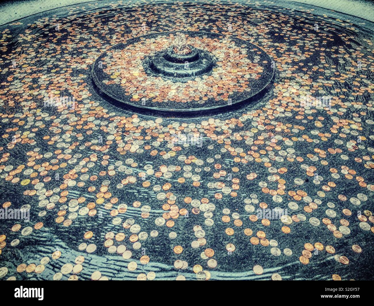 Coins thrown into a shallow fountain for good luck, USA Stock Photo - Alamy