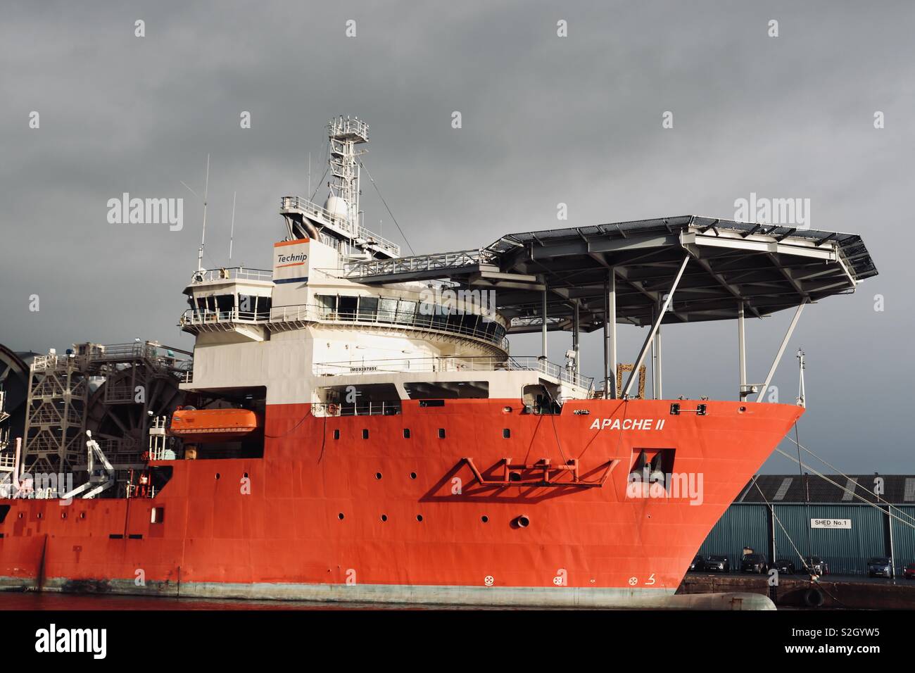 Working ship with helipad moored at dockside Stock Photo - Alamy