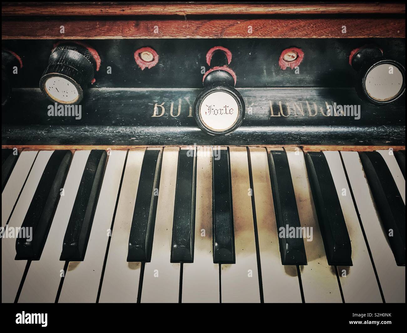 Stop faces on antique pump organ at Toeka Stoor, South Africa Stock ...