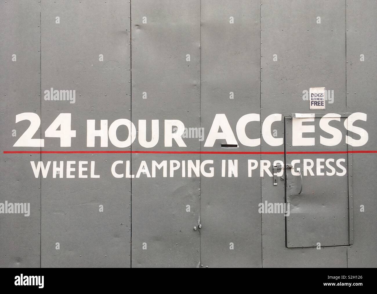 Wheel clamping sign on a doorway in London, England Stock Photo - Alamy