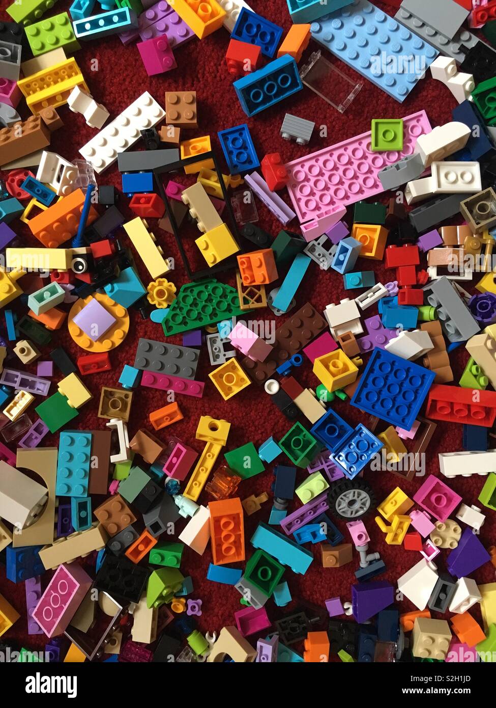 Lego play blocks lie on the floor Stock Photo - Alamy
