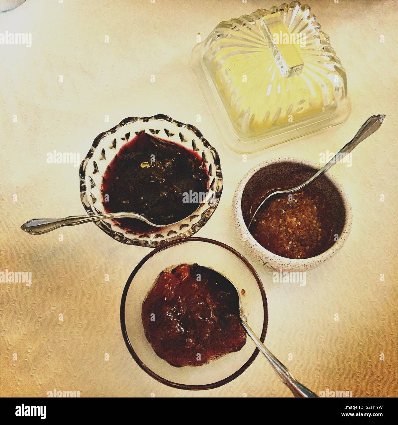 Old fashioned jars and butter dish with homemade jams and butter Stock ...