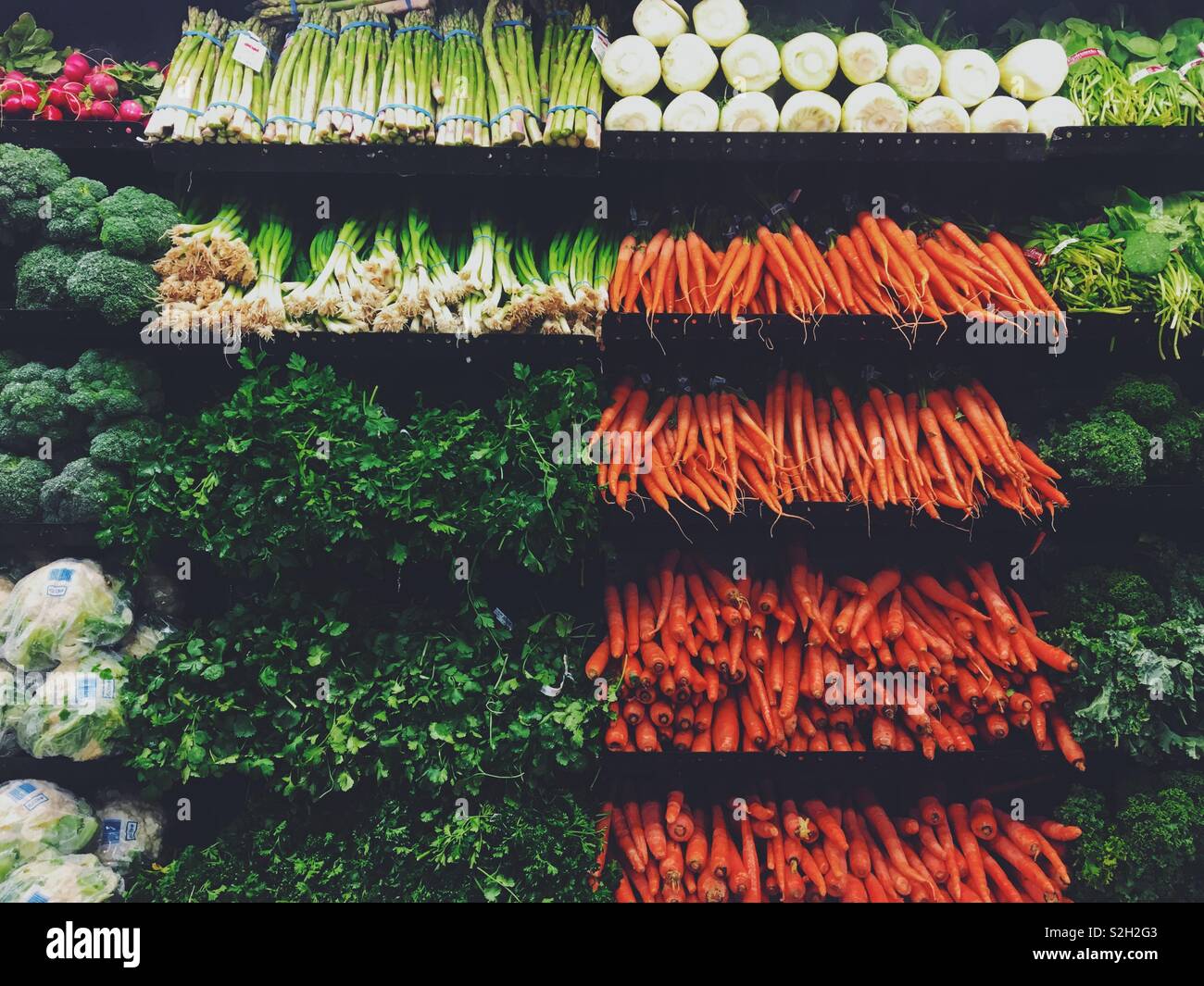 Vegetables on store shelf at the produce section of a grocery store ...