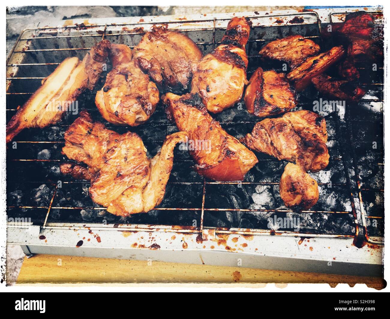 Grilled chicken and pork barbecue Stock Photo - Alamy