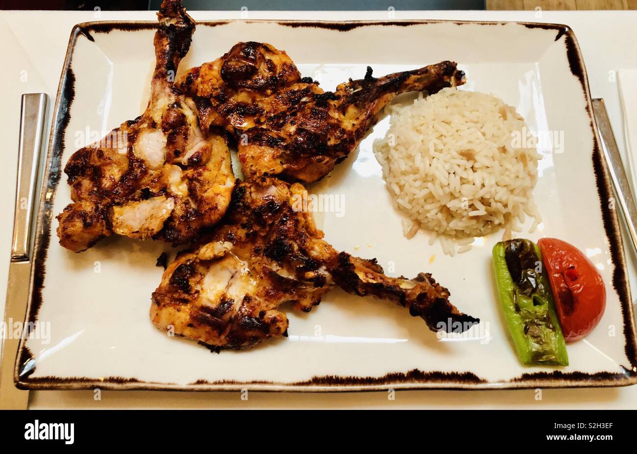 Chicken Chops and Rice Stock Photo - Alamy