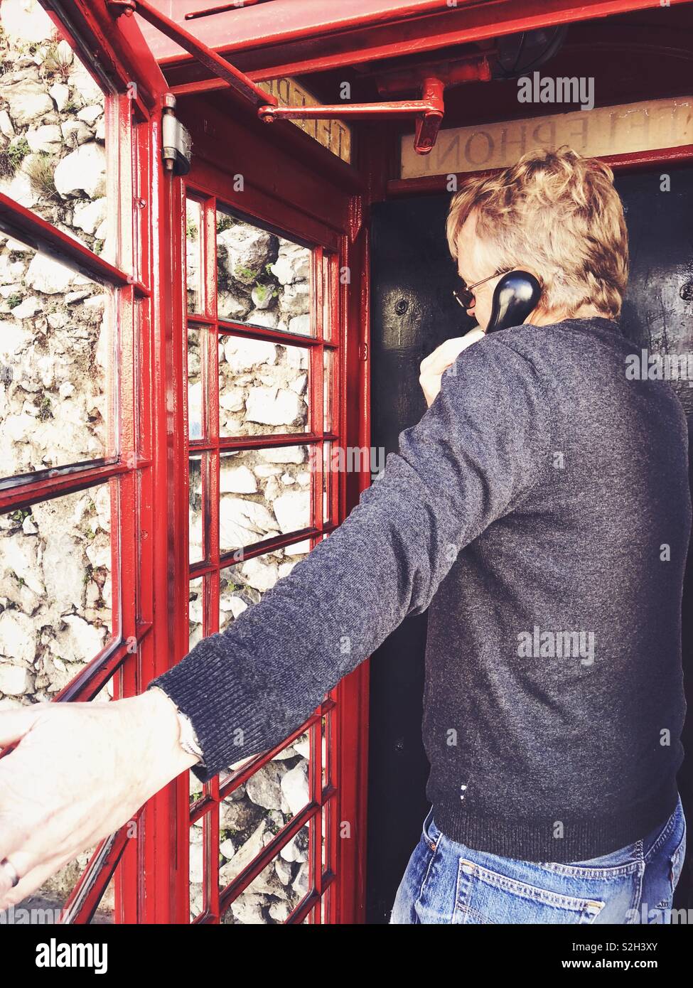 Man inside telephone box hi-res stock photography and images - Alamy