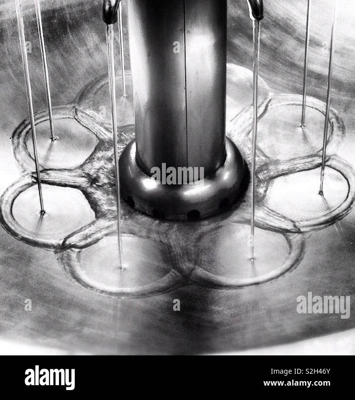 Communal stainless steel wash basin in an engineering firms shop floor ...