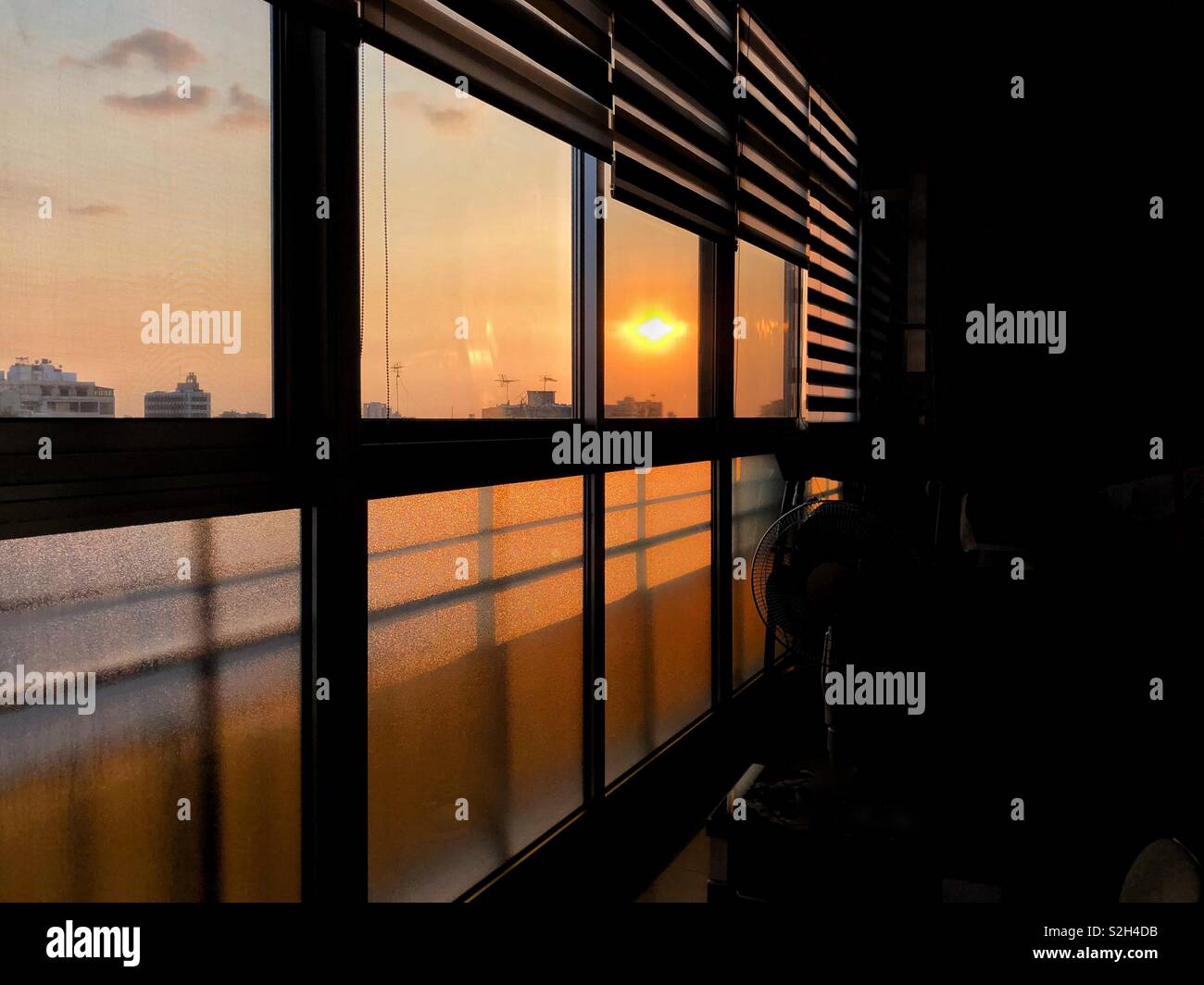 Sunset behind the house window balcony Stock Photo - Alamy