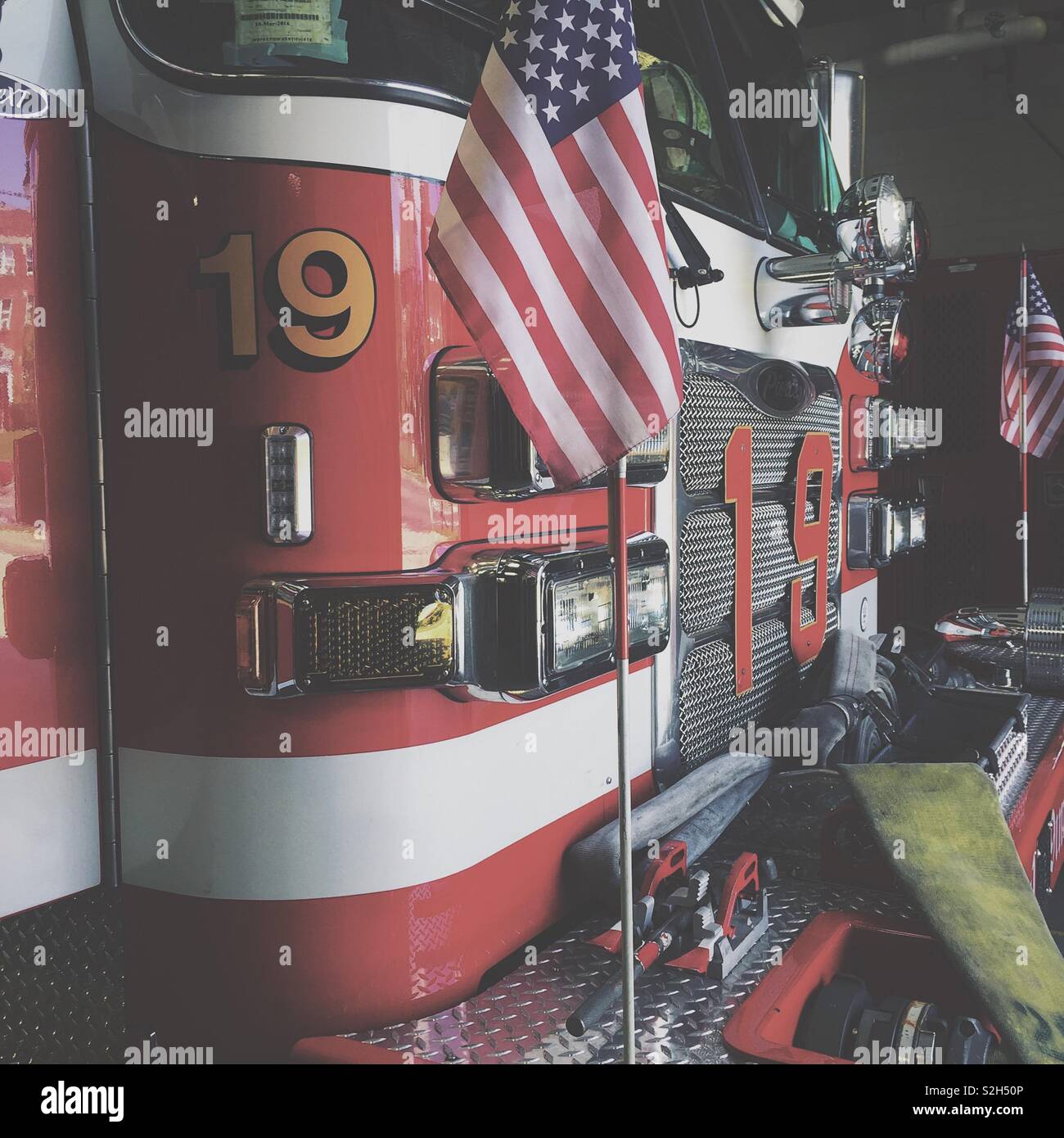 Dramatic front view of a fire engine with American flags Stock Photo ...