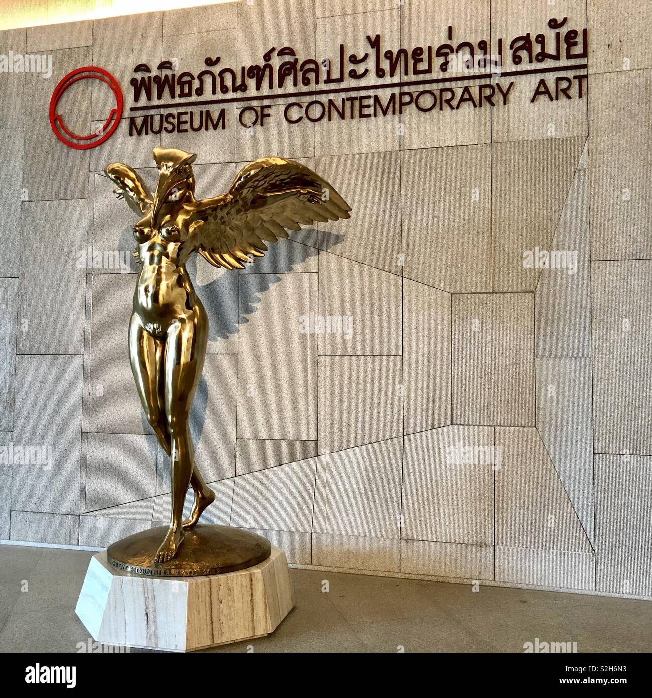 Gold female form sculpture outside MOCA Bangkok Stock Photo - Alamy